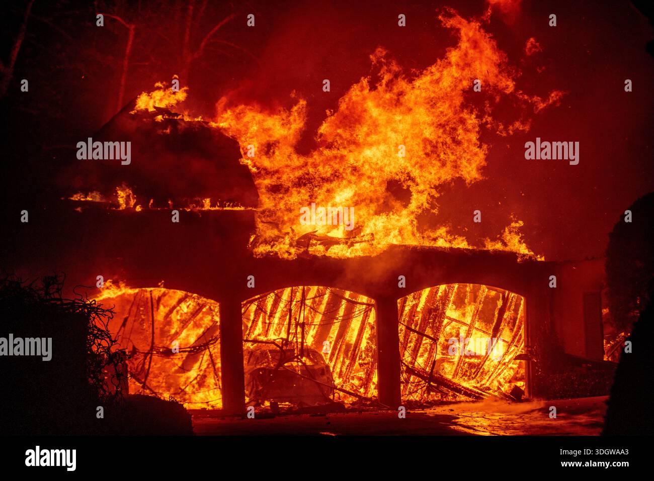 FILE - The Eaton Fire burns a residence Wednesday, Jan. 8, 2025 in ...