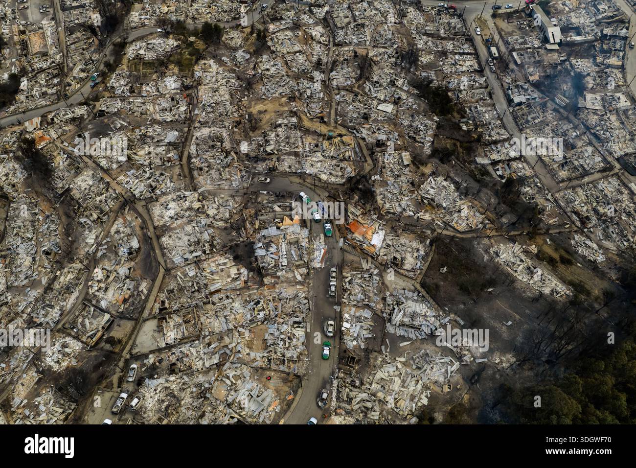 Areas lie burned by wildfires near Lirquen, Chile, Sunday, Jan. 18 ...