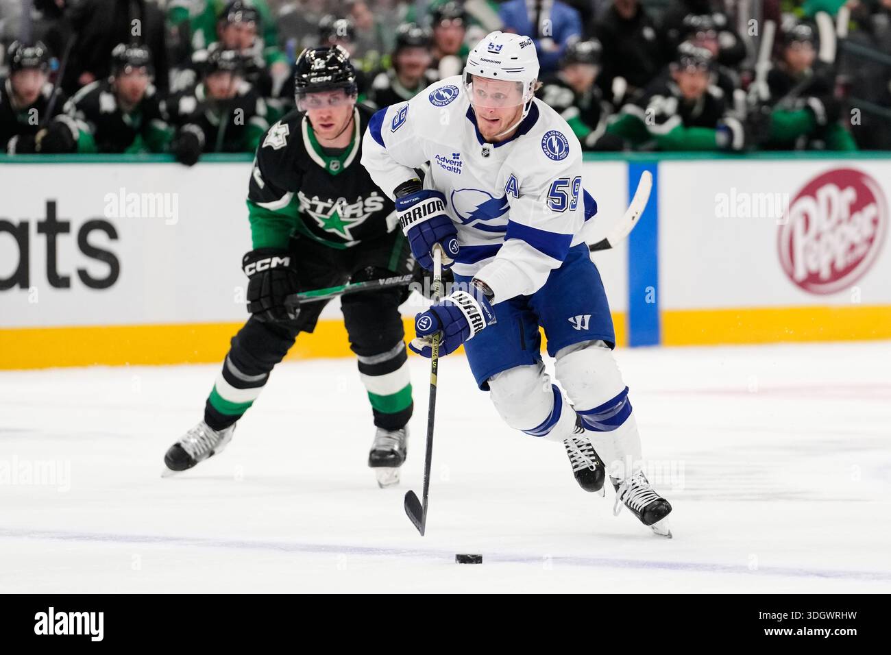 Tampa Bay Lightning center Jake Guentzel (59) controls the puck on an ...