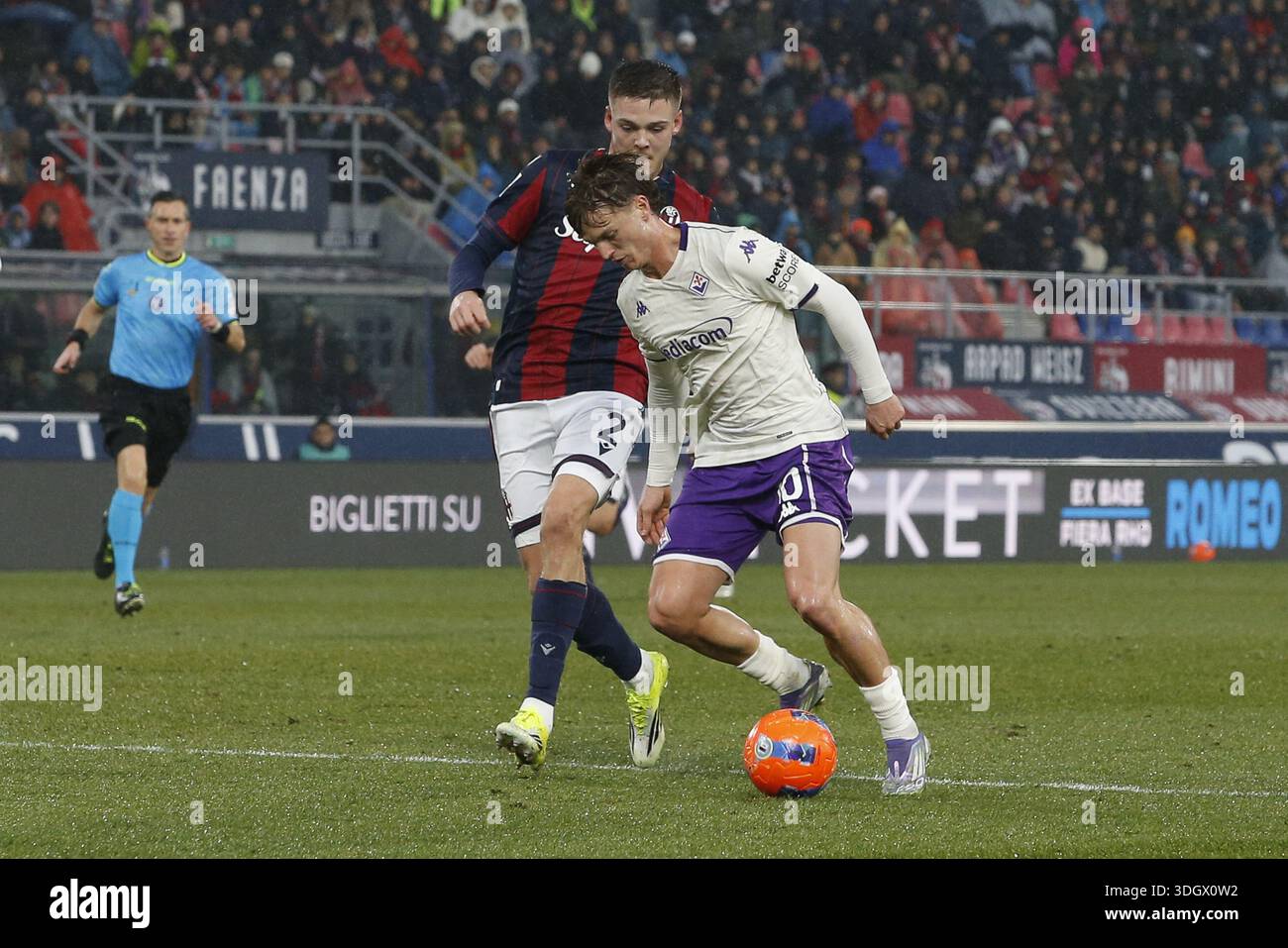 Albert Guomundsson of ACF Fiorentina competes for the ball with Emil ...