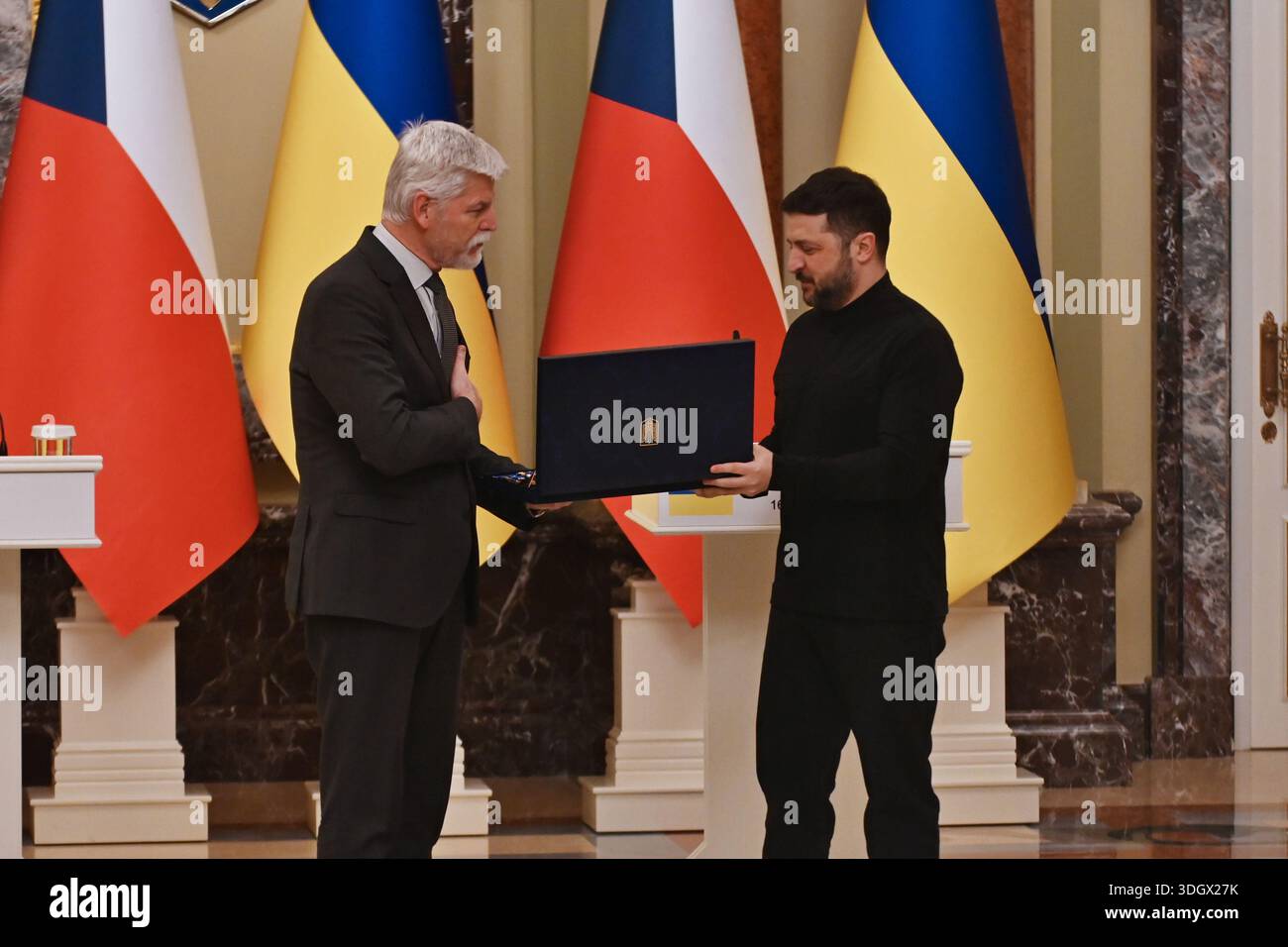 President of Ukraine Volodymyr Zelenskyy (R) awards the President of ...