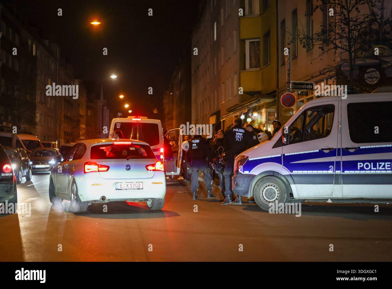 Duesseldorf, Germany. 18th Jan, 2026. Police officers watch ...