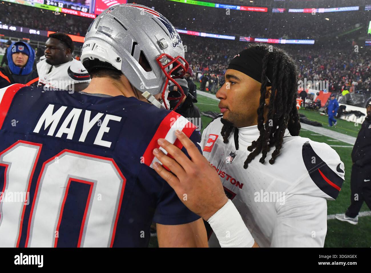 New England Patriots quarterback Drake Maye (10) hugs Houston Texans ...