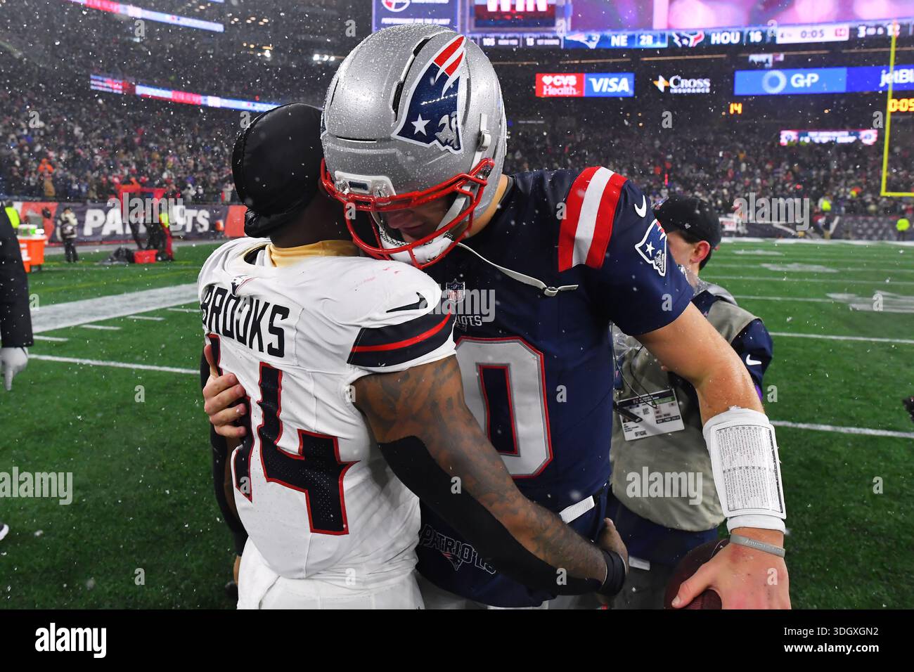Houston Texans running back British Brooks, left, hugs New England ...