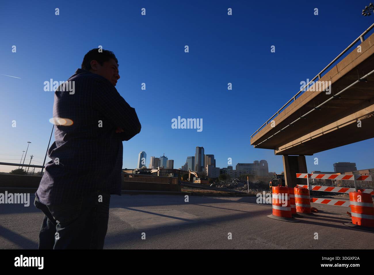 Fernando Careaga looks a demolished overpass on a closed interstate ...