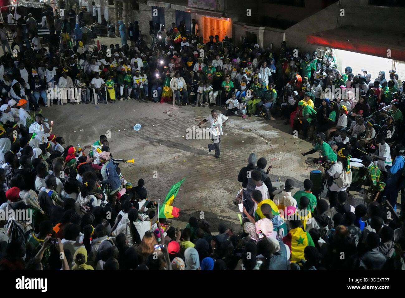 A girl dances as Senegal fans gather to celebrate after Senegal won the ...