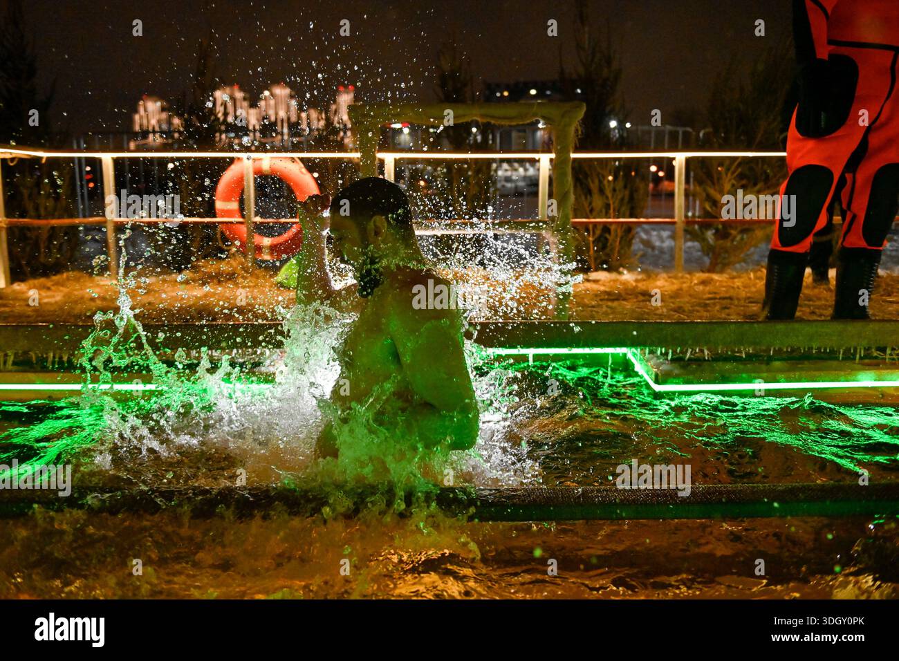 Moscow, Russia. 18th Jan, 2026. A man takes a dip in the icy water ...