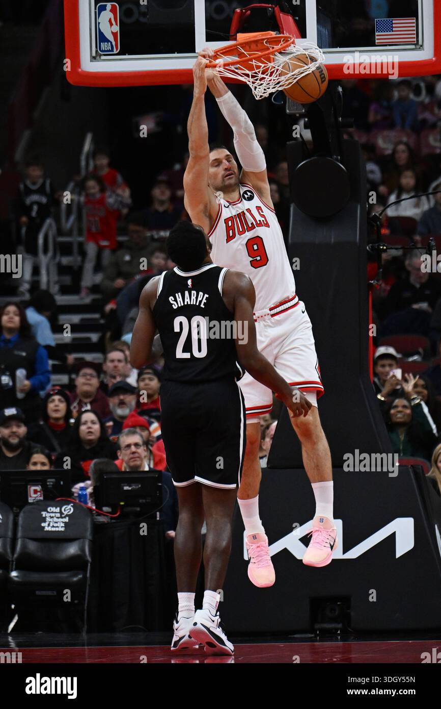 Chicago Bulls' Nikola Vucevic (9) dunks during the first half of an NBA ...