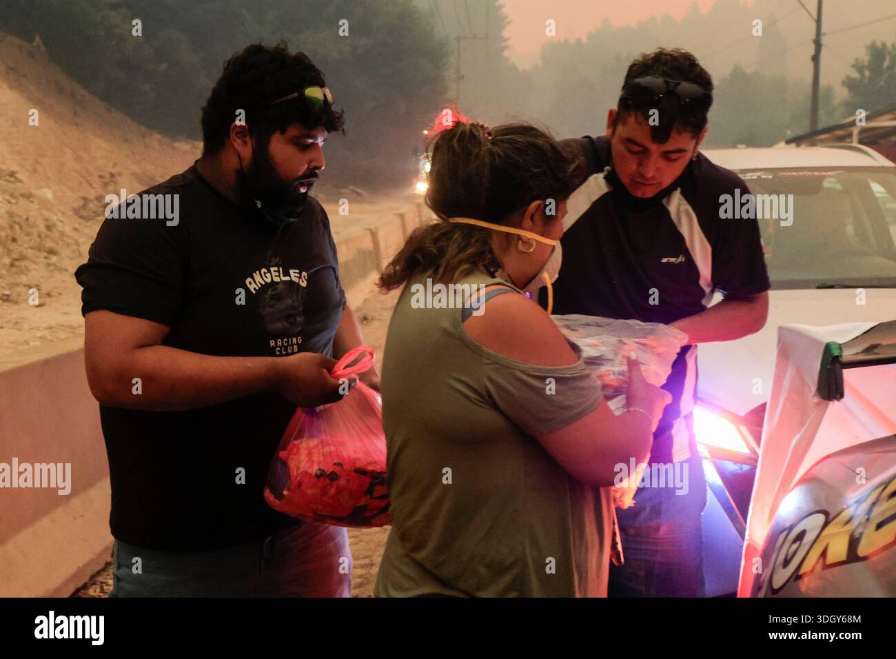 Volunteers distribute aid to victims and workers affected by the ...