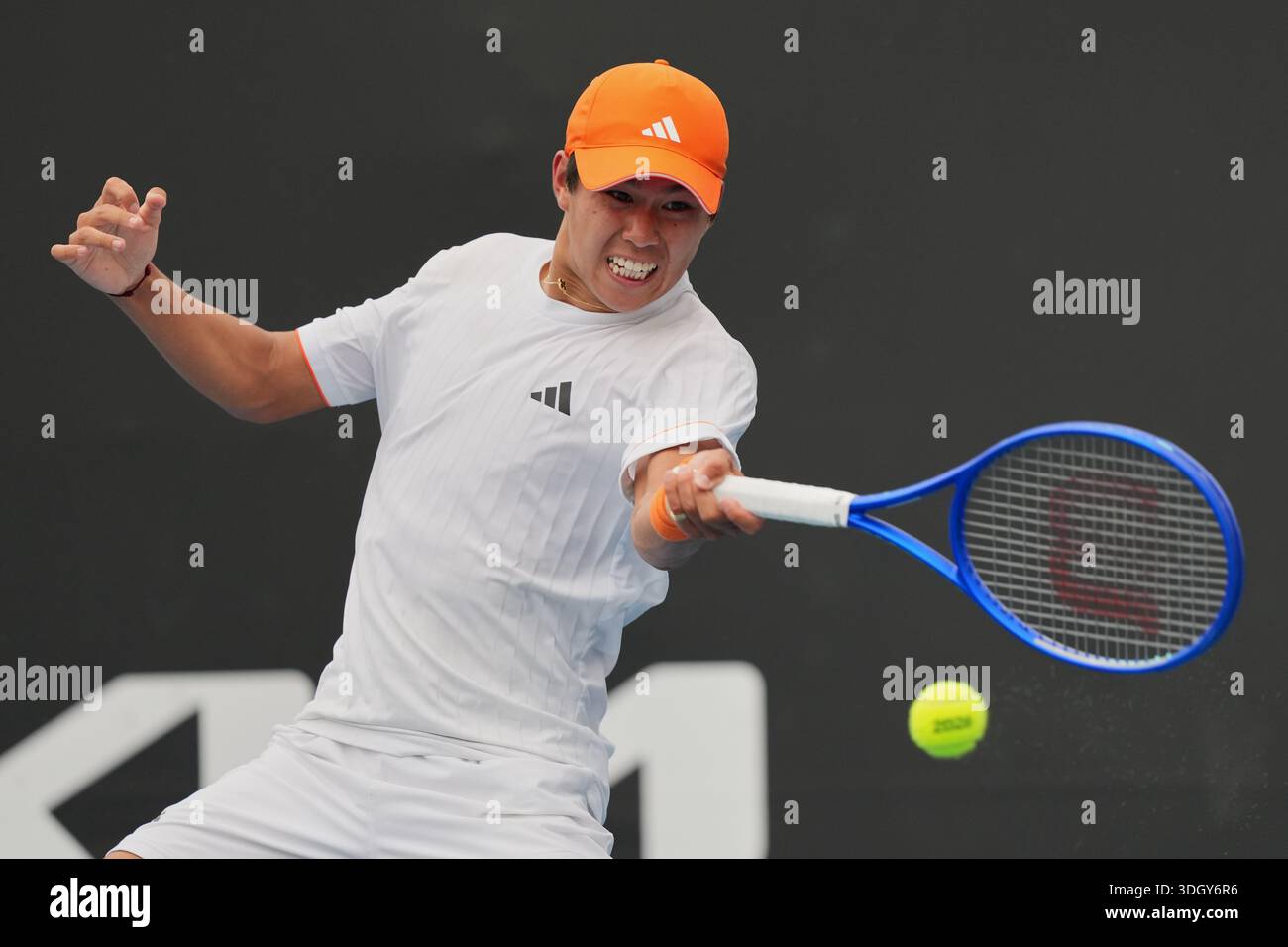 Learner Tien of the U.S. plays a forehand return to compatriot Marcos ...