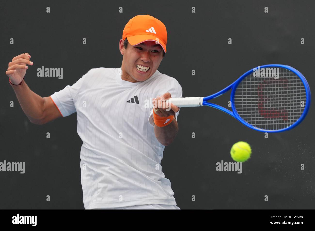 Learner Tien of the U.S. plays a forehand return to compatriot Marcos ...