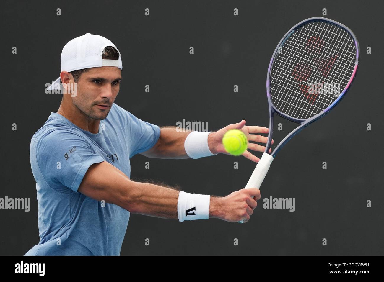 Marcos Giron of the U.S. plays a backhand return to compatriot Learner ...