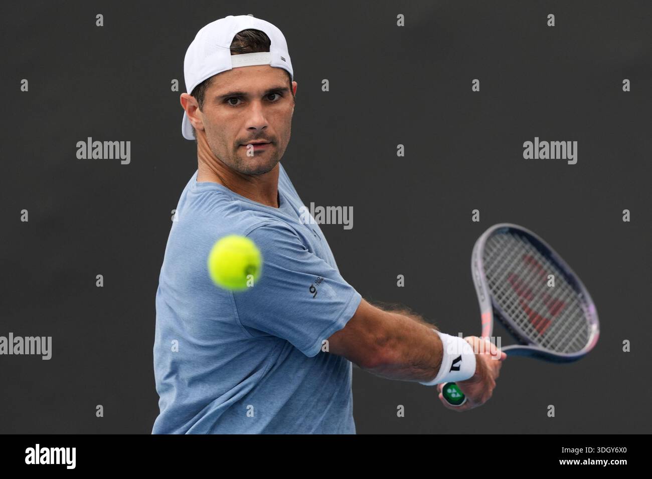 Marcos Giron of the U.S. plays a backhand return to compatriot Learner ...