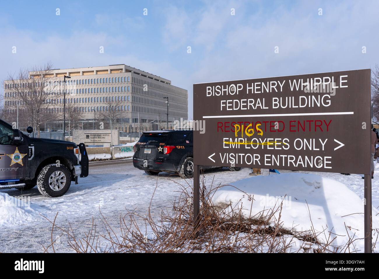 A sign with graffiti is seen outside the Whipple Federal Building ...