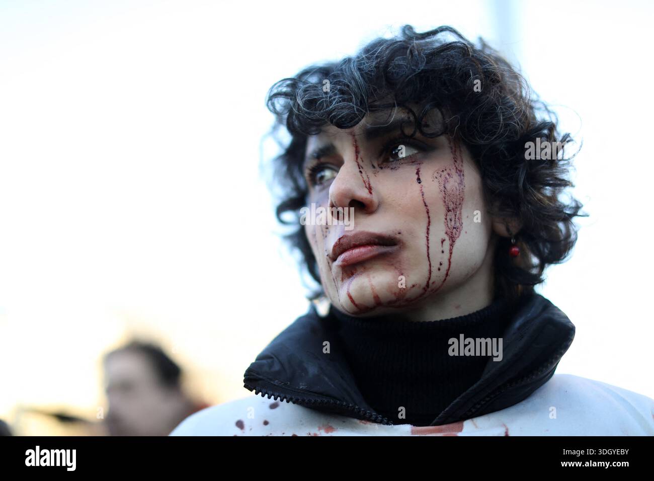 Paris, France. 19th Jan, 2026. A woman wearing blood like stain makeup ...