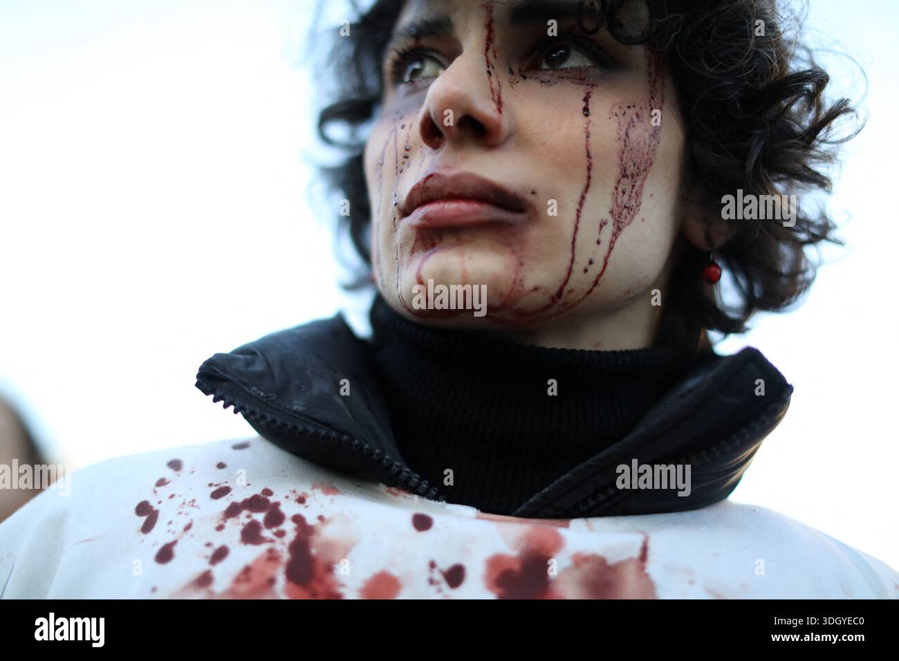 Paris, France. 19th Jan, 2026. A woman wearing blood like stain makeup ...
