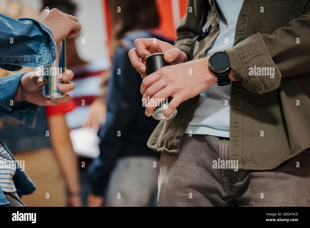 Teen students drinking an energy drink in school hallway Stock Photo ...