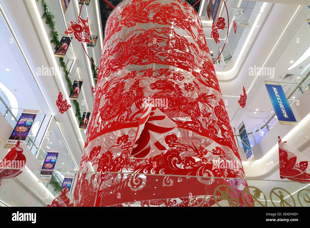 A giant paper-cut horse installation hangs in a mall in Xi'an City ...