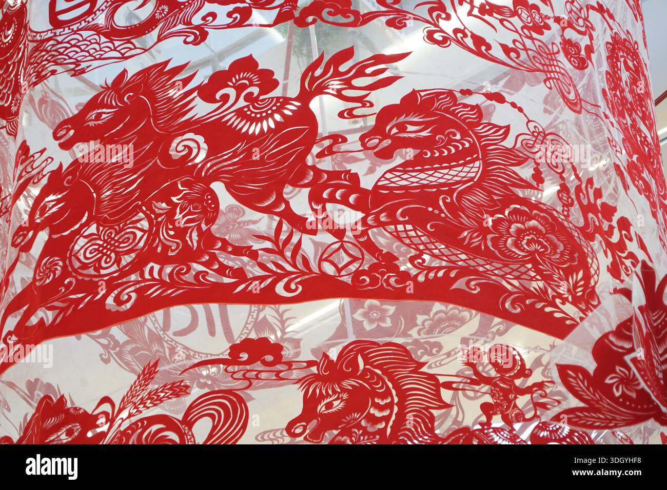 A giant paper-cut horse installation hangs in a mall in Xi'an City ...