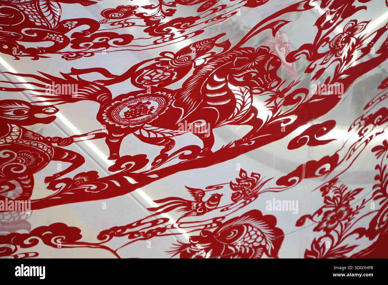 A giant paper-cut horse installation hangs in a mall in Xi'an City ...