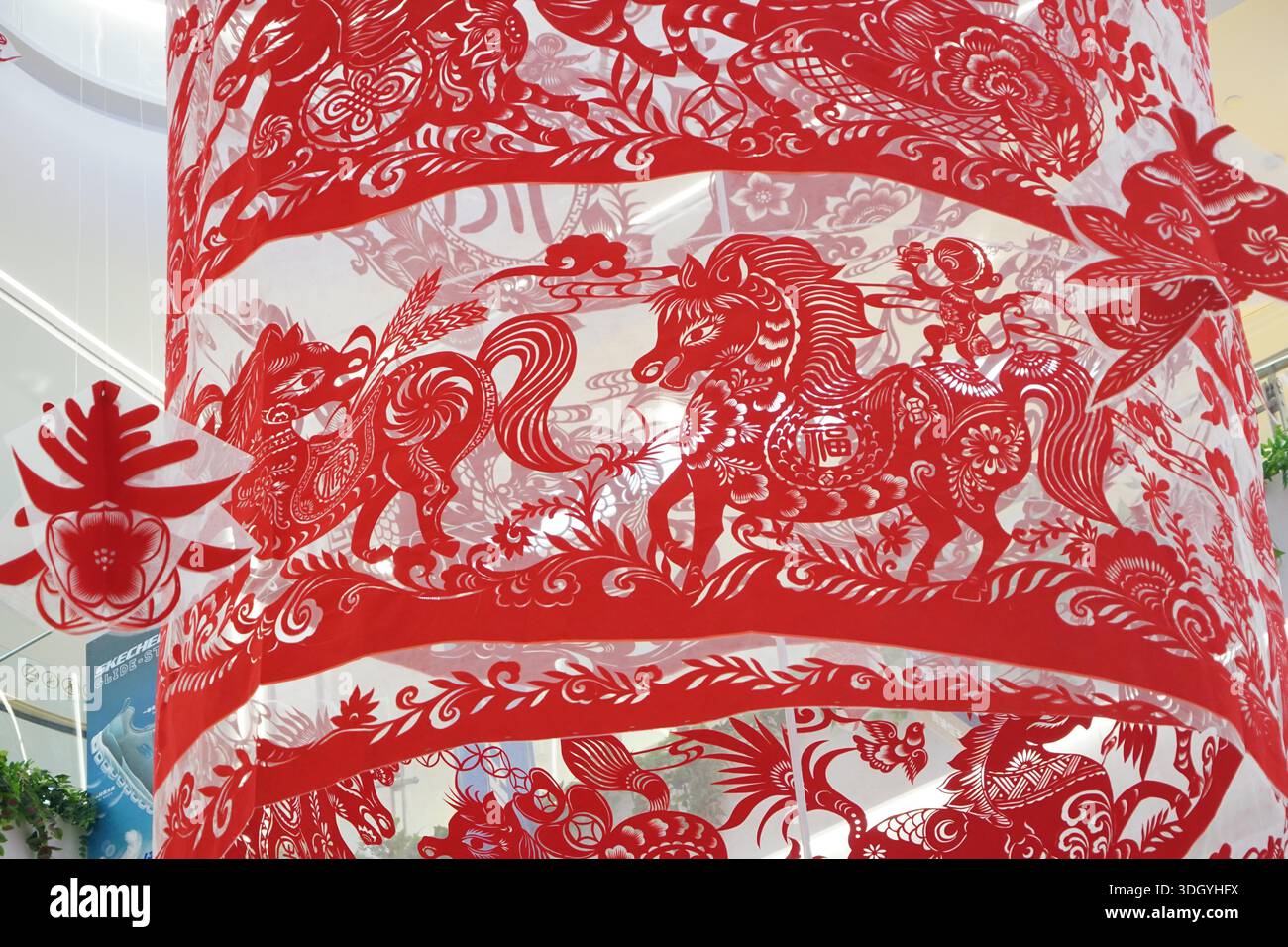 A giant paper-cut horse installation hangs in a mall in Xi'an City ...