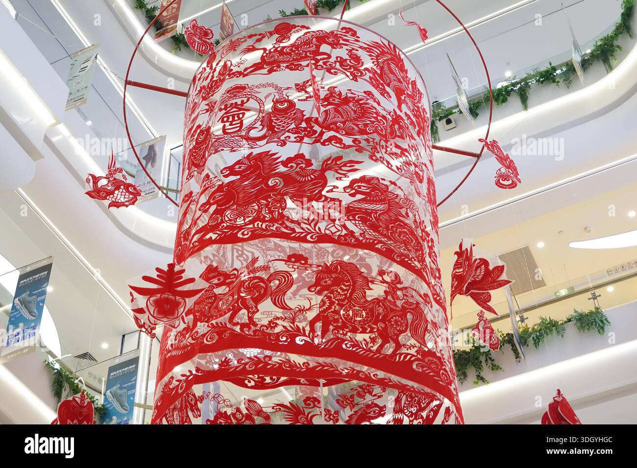 A giant paper-cut horse installation hangs in a mall in Xi'an City ...