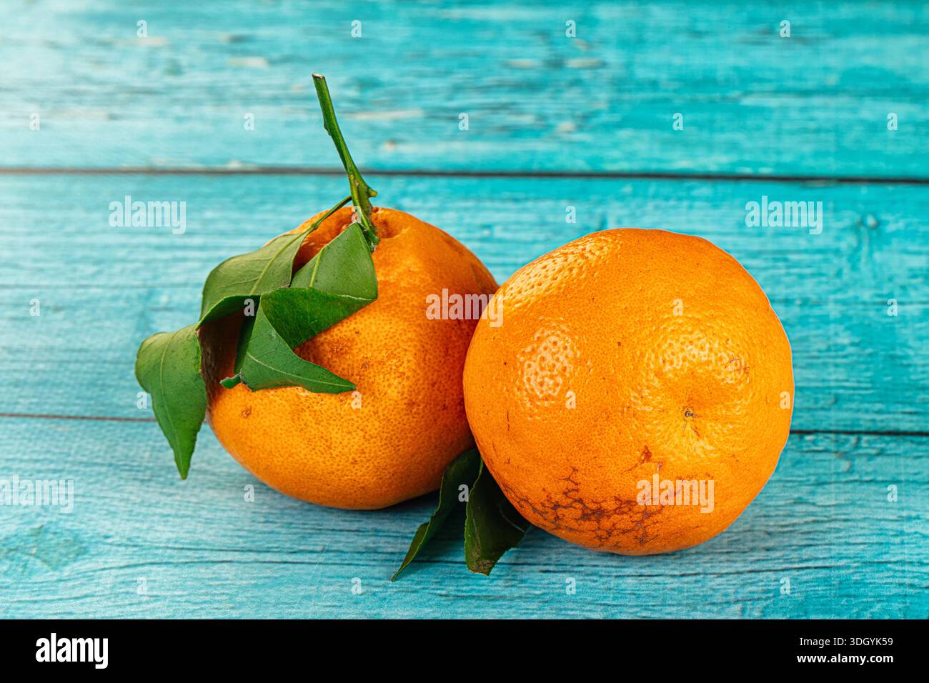 Sweet maniola citrus tropical fruit with leaves Stock Photo - Alamy