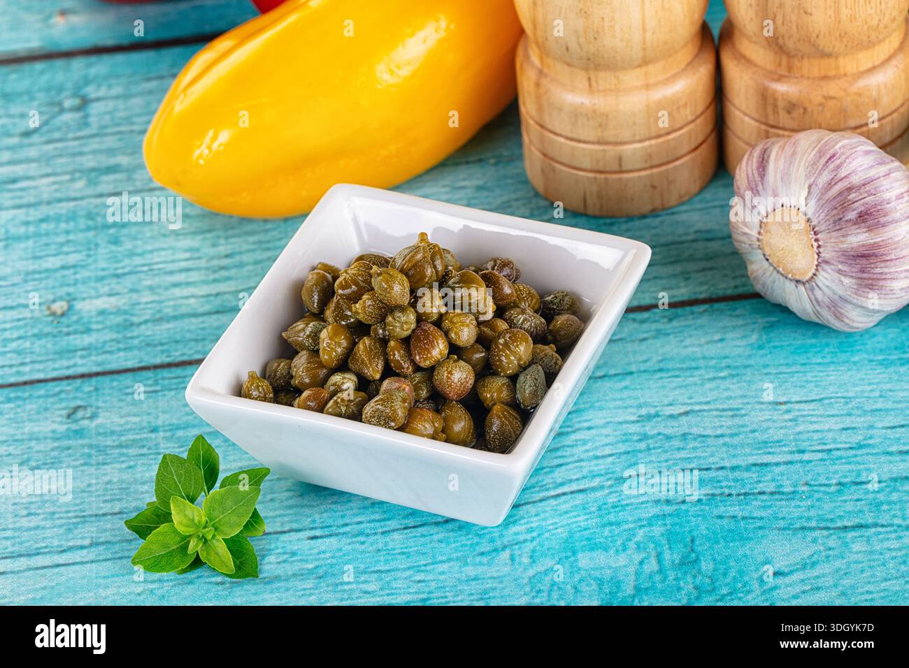 Pickled canned capers snack antipasti in the bowl Stock Photo - Alamy