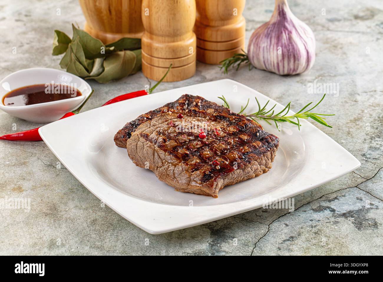 Grilled juicy beef steak with pepper served rosemary Stock Photo - Alamy
