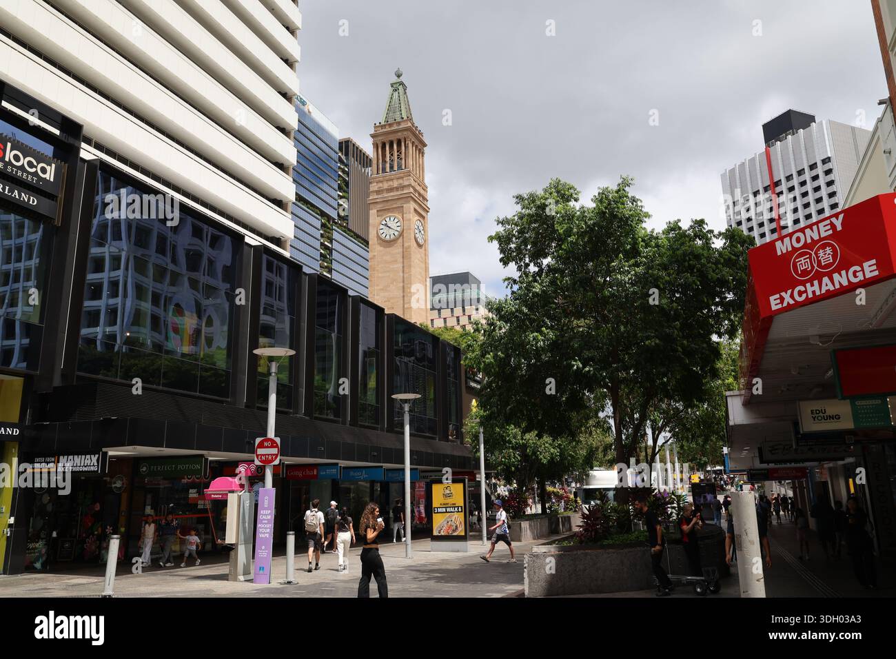 People walk, sit, and use public space at King George Square in the ...