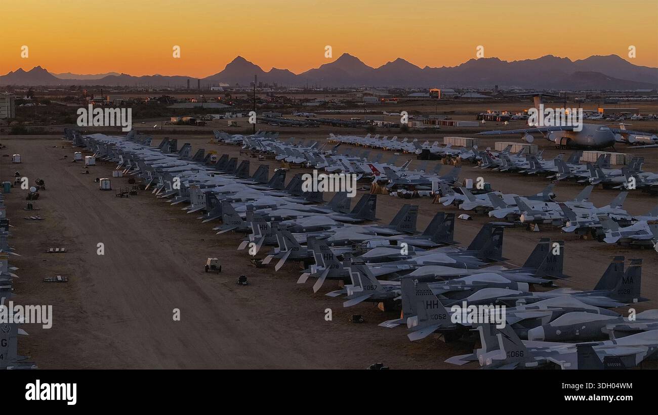 Aerial view of rows of retired military aircraft fade into the horizon ...