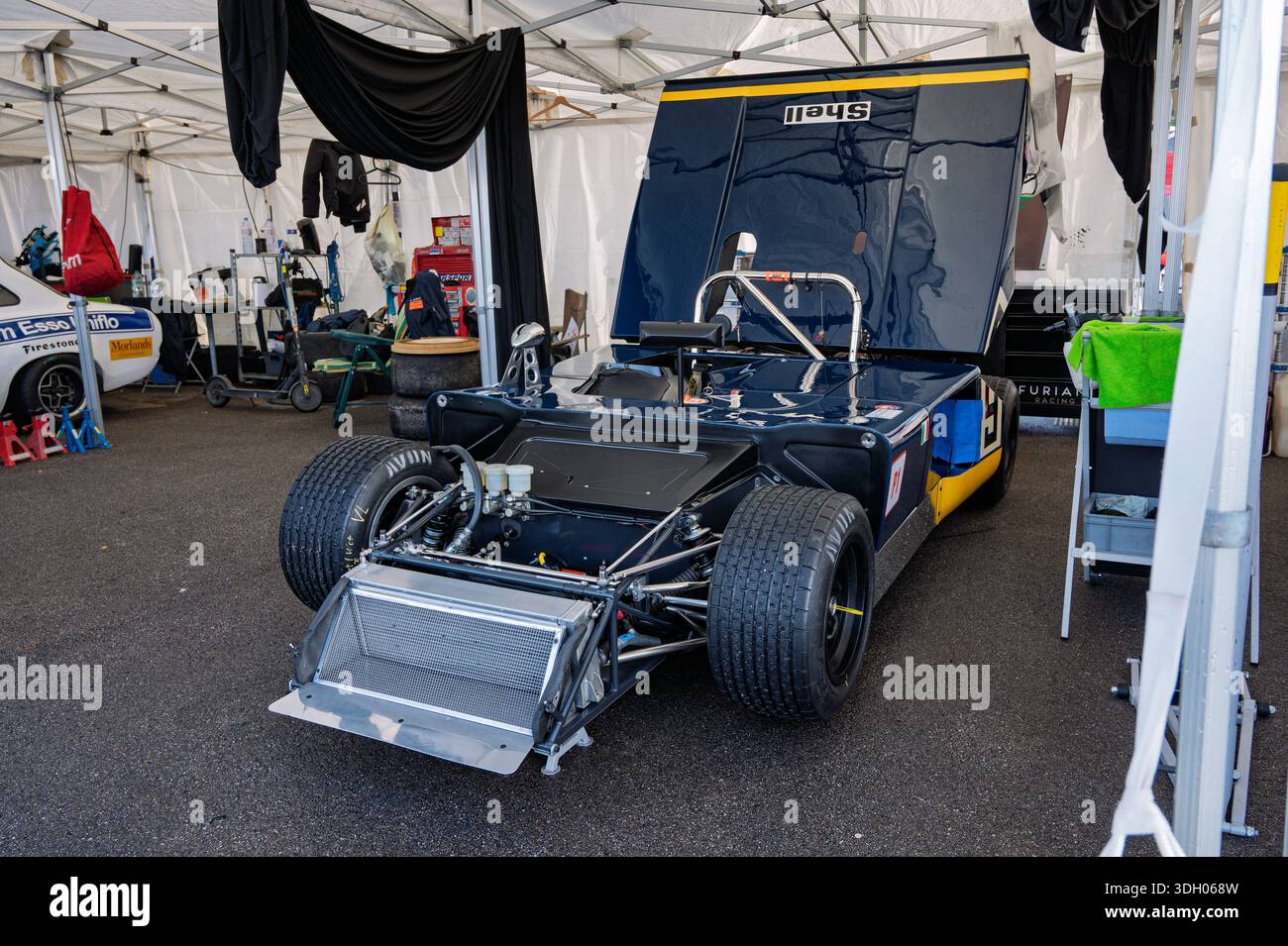Front view 1971 Chevron B19 classic race car in paddock. Blue ...