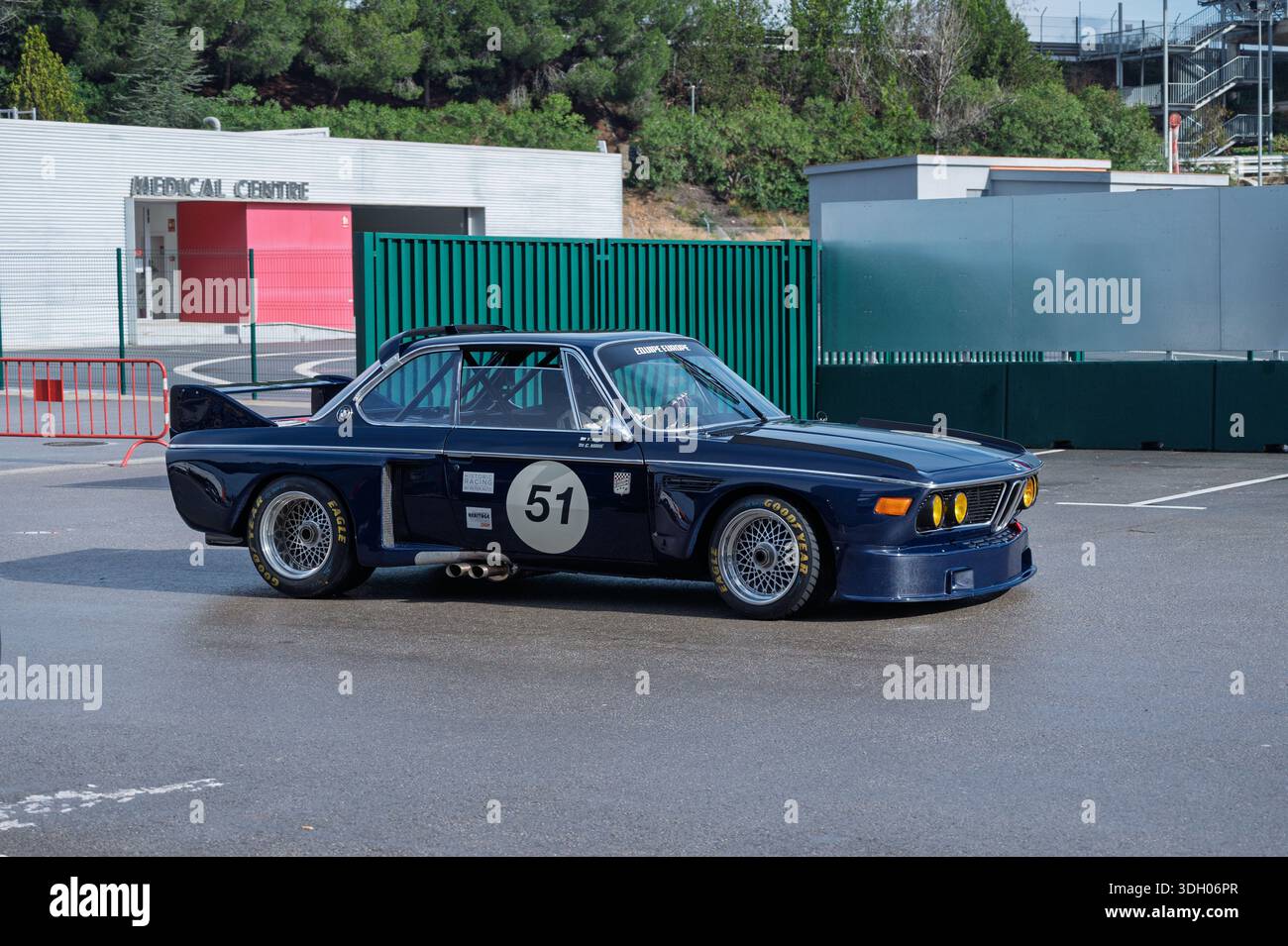 Side view of a classic 1975 blue German BMW 3.5 CSL race car, featuring ...
