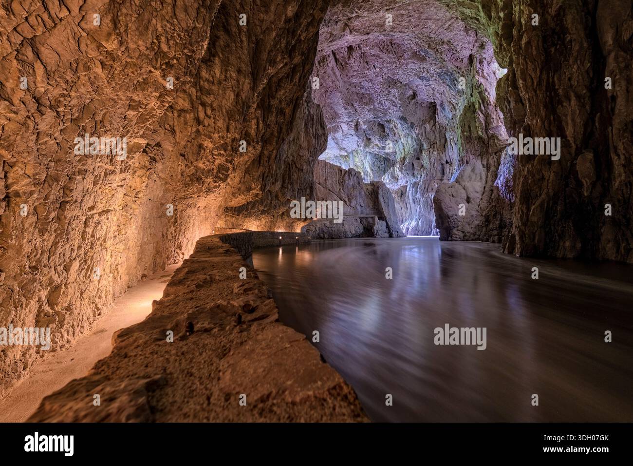 Illuminated pathway inside the Skocjan Caves running alongside an ...