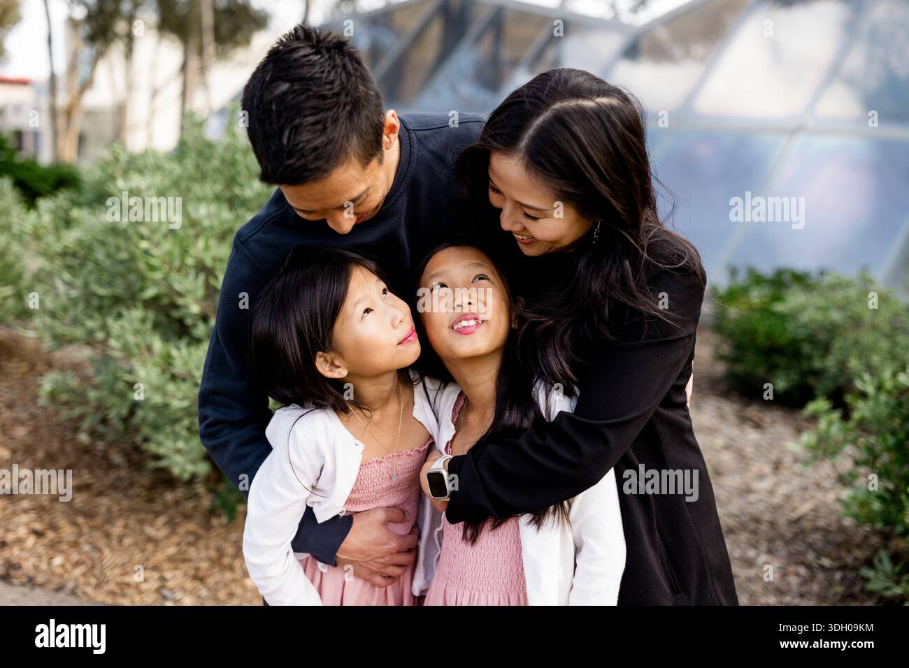 Asian Parents Hugging Daughters on UCSD Campus in San Diego Stock Photo ...