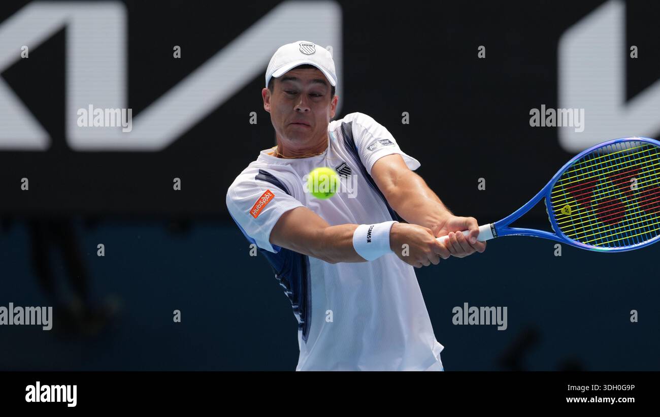 Mackenzie McDonald of the U.S. plays a backhand return to Alex de ...