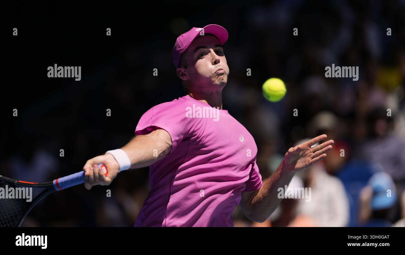 Arthur Fery of Britain plays a forehand return to Flavio Cobolli of ...