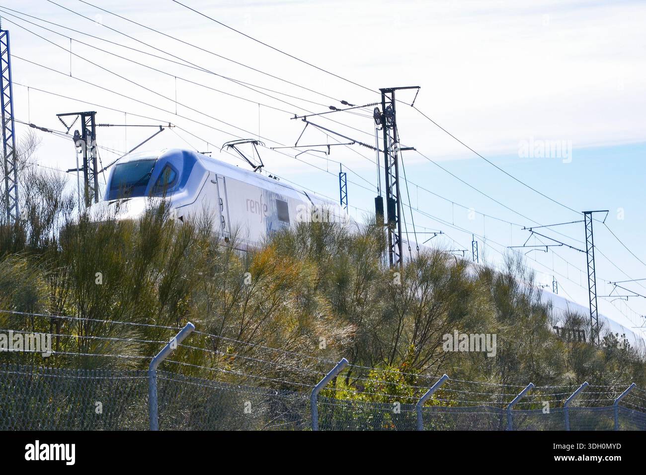 High-speed RENFE train travelling on railway tracks in Spain, showing ...