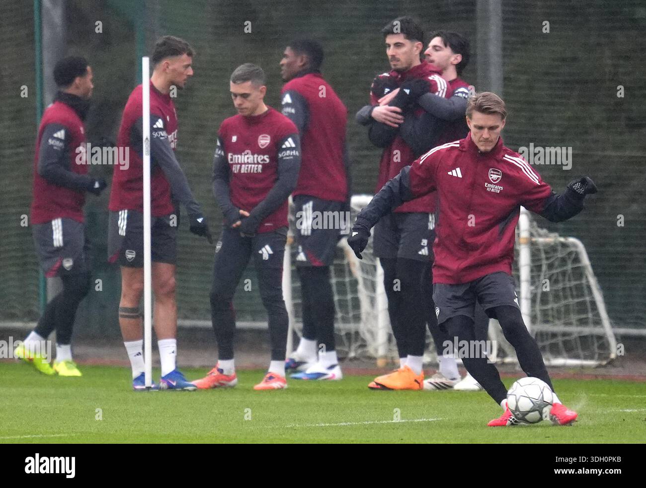 Arsenal's Martin Odegaard (right) and team-mates during a training ...