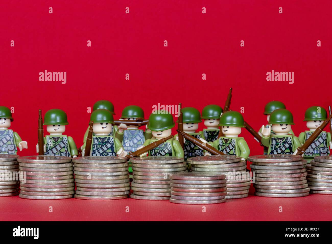 Military Budget Army of Toy Soldiers Standing on Coin Stacks Soldiers ...