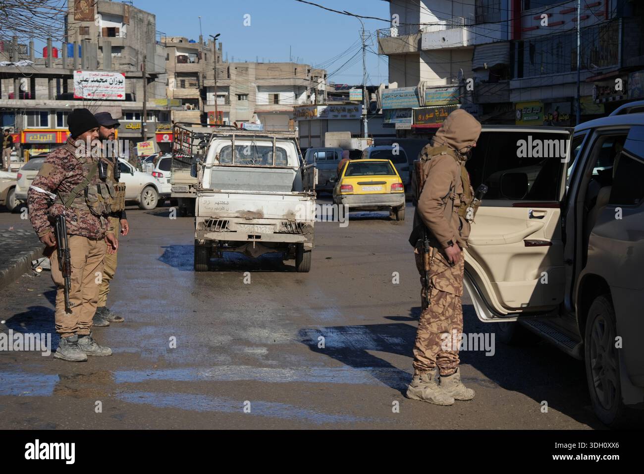 Ar Raqqah, Syria. 19th Jan, 2026. Syrian army soldiers check on ...