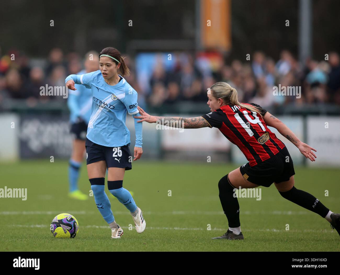 Manchester City's Yui Hasegawa (left) during the Women's FA Cup fourth ...