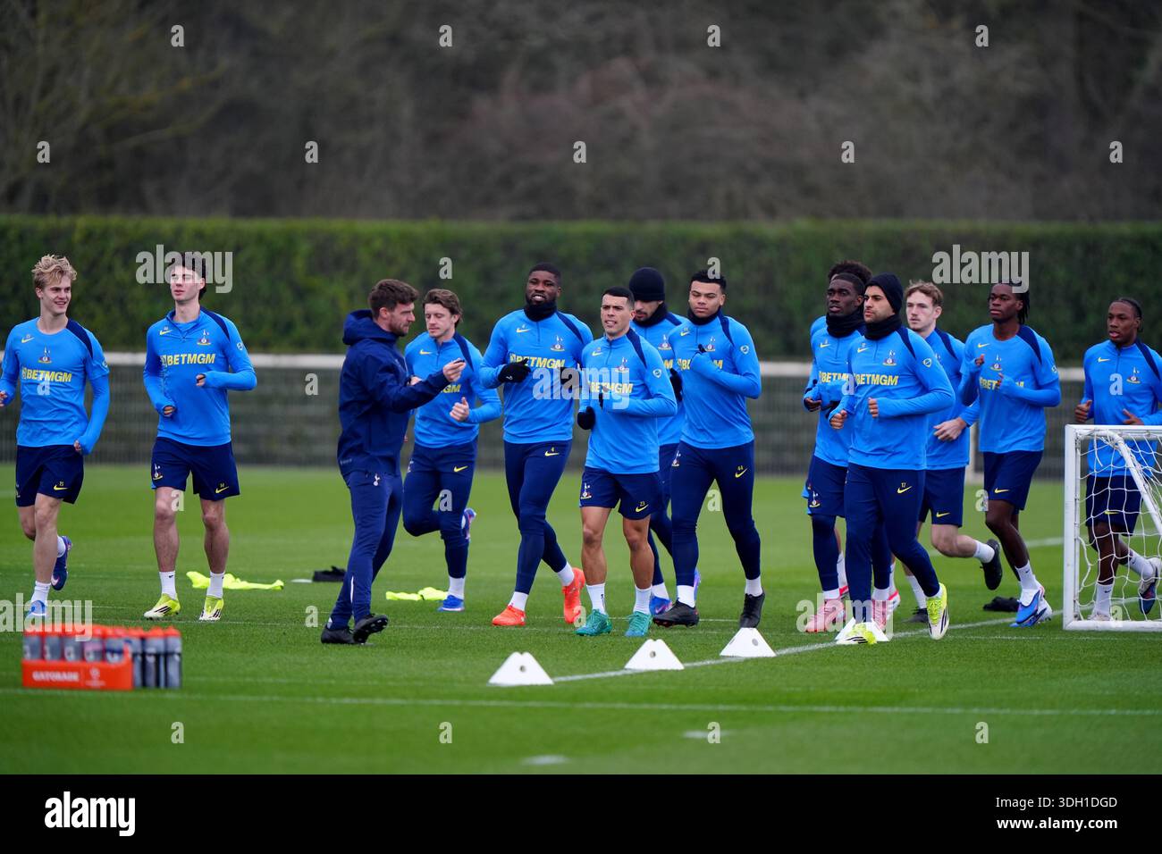 Tottenham Hotspur players warm up during a training session at the ...