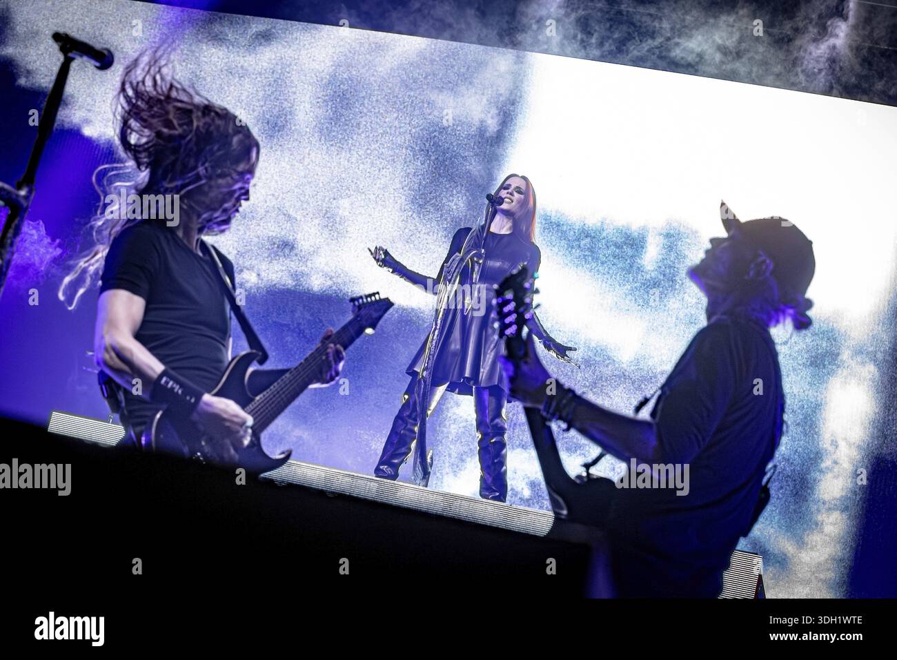 Guitarists Mark Jansen and Isaac Delahaye with singer Simone Simons ...