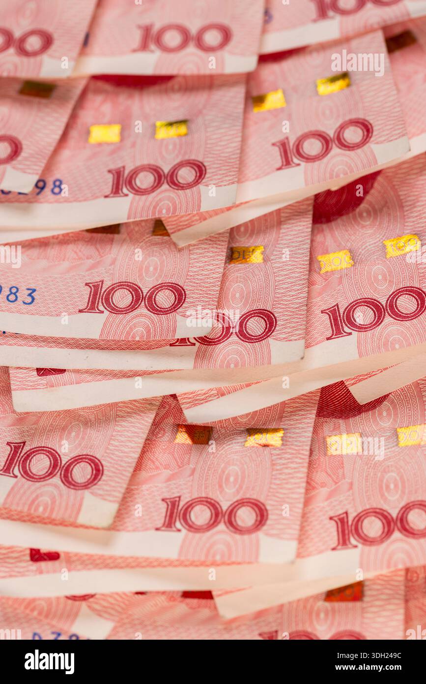 red Chinese cash in denominations of one hundred yuan, heap of paper ...