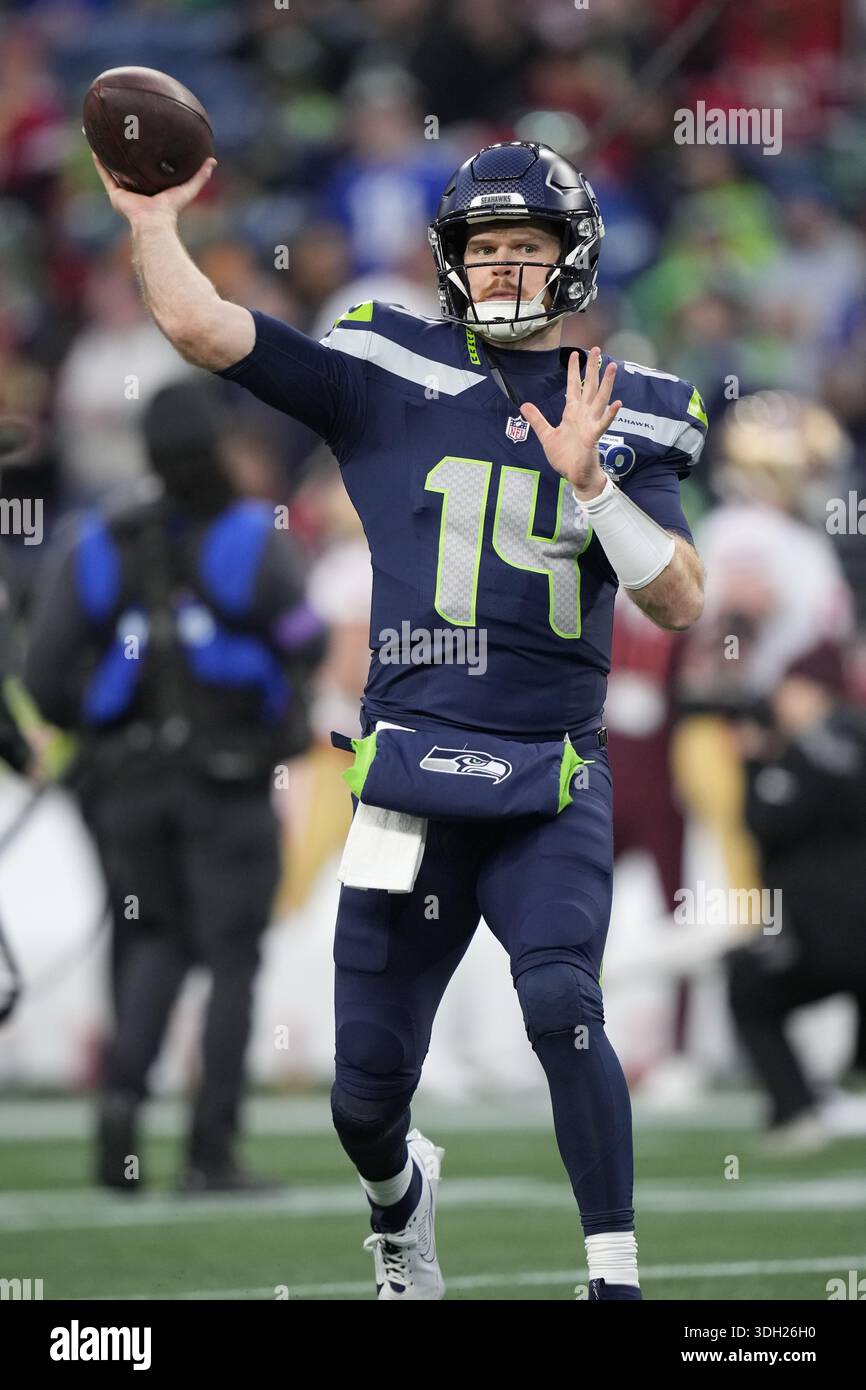 Seattle Seahawks quarterback Sam Darnold (14) passes the ball in an NFL ...