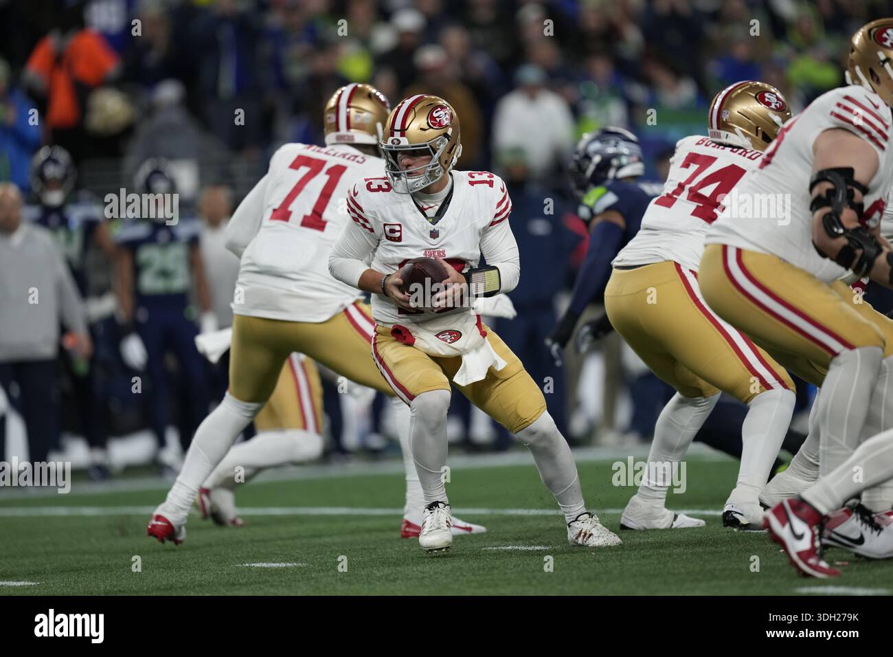 San Francisco 49ers quarterback Brock Purdy (13) looks to hand off the ...