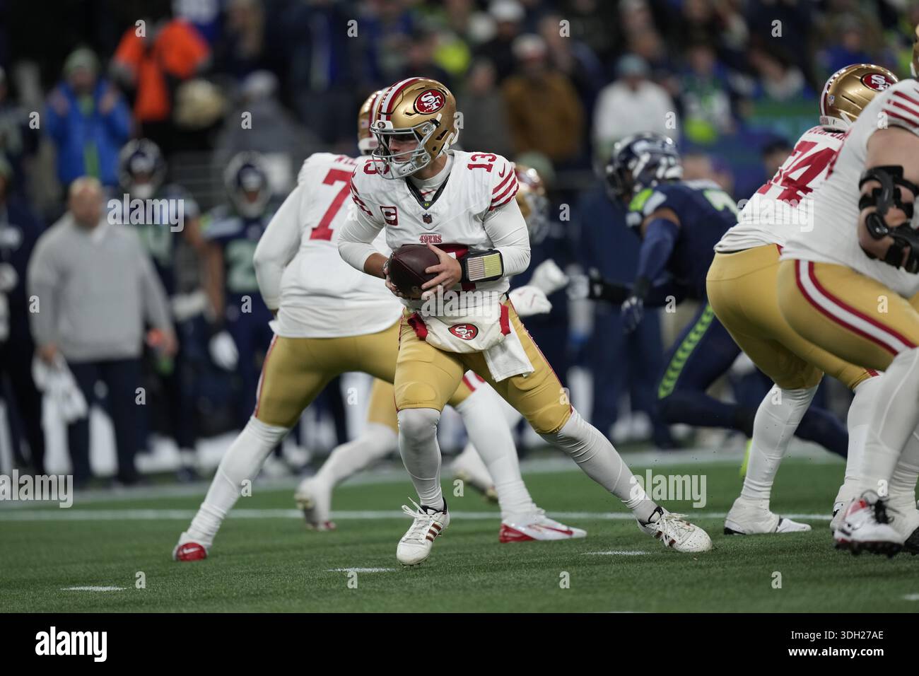 San Francisco 49ers quarterback Brock Purdy (13) looks to hand off the ...