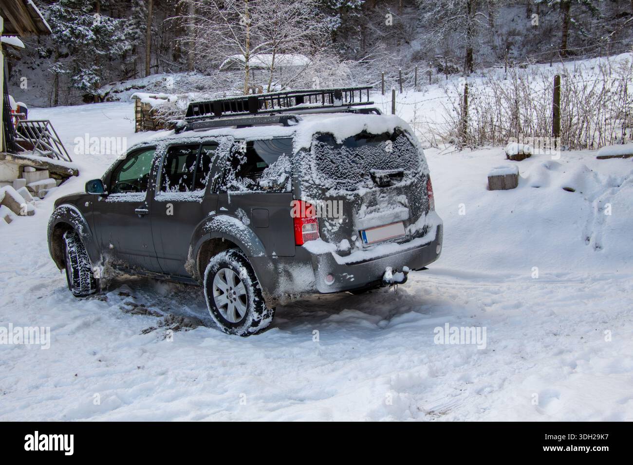 Four-wheel drive car covered with snow and ice Stock Photo - Alamy