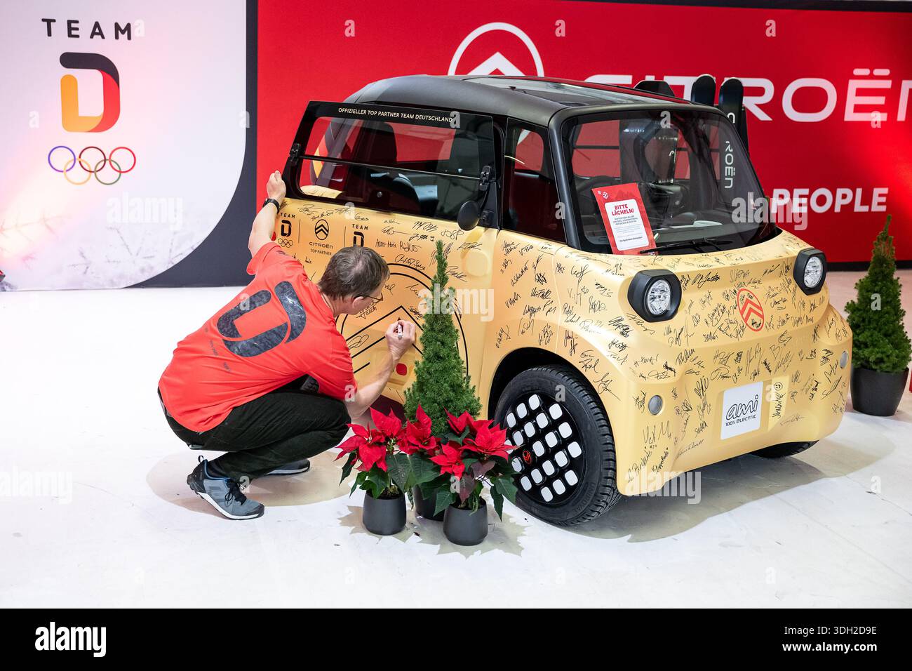 An athlete signs on the sponsor car from Citroen GER, DOSB Olympic Team ...